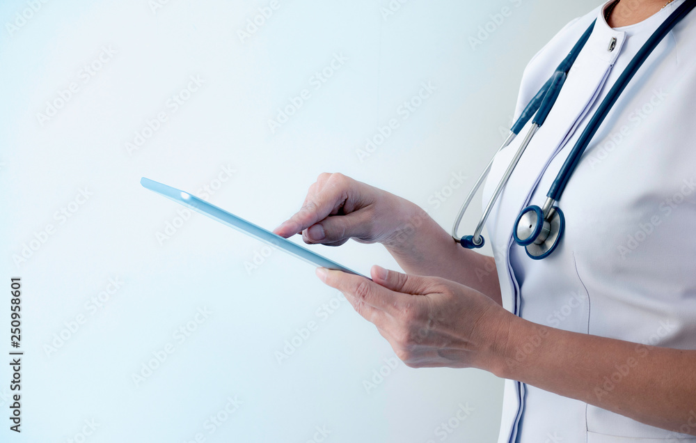 Nurse using modern touchscreen tablet computer in for looking patient ...