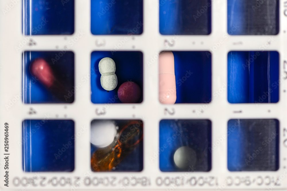 Pills in box with dates. Different medicines separated per dates and ...