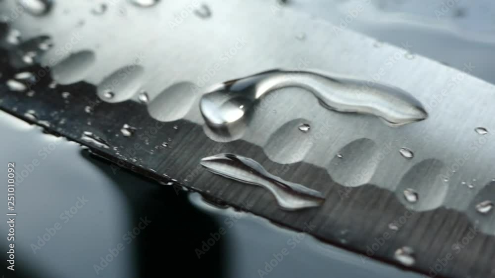 Chef's knife close-up. Knife santoku. blade blade. Drops of water flow ...