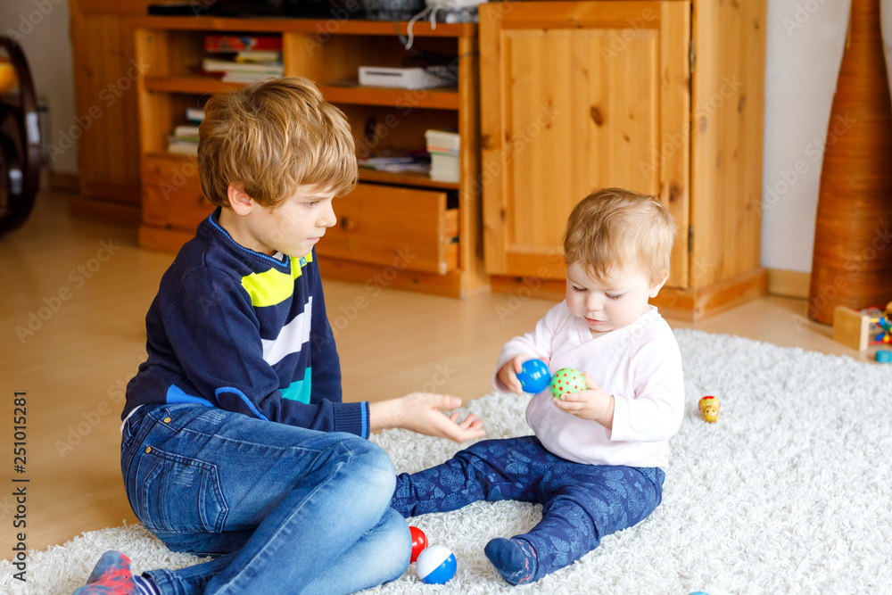 Happy little kid boy with cute little baby girl, cute sister. Siblings ...