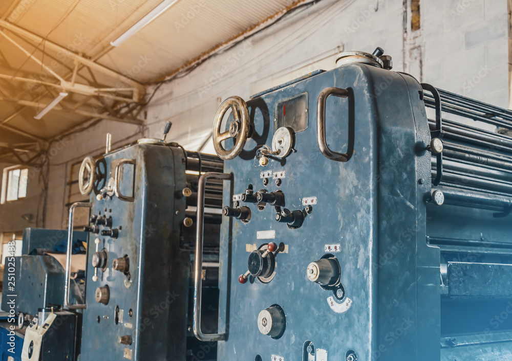 Old vintage printing machine in the print shop. Magazine, newspaper ...