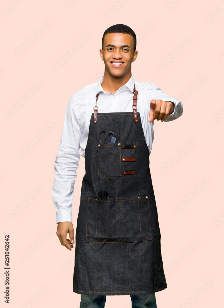 Young afro american barber man points finger at you with a confident ...