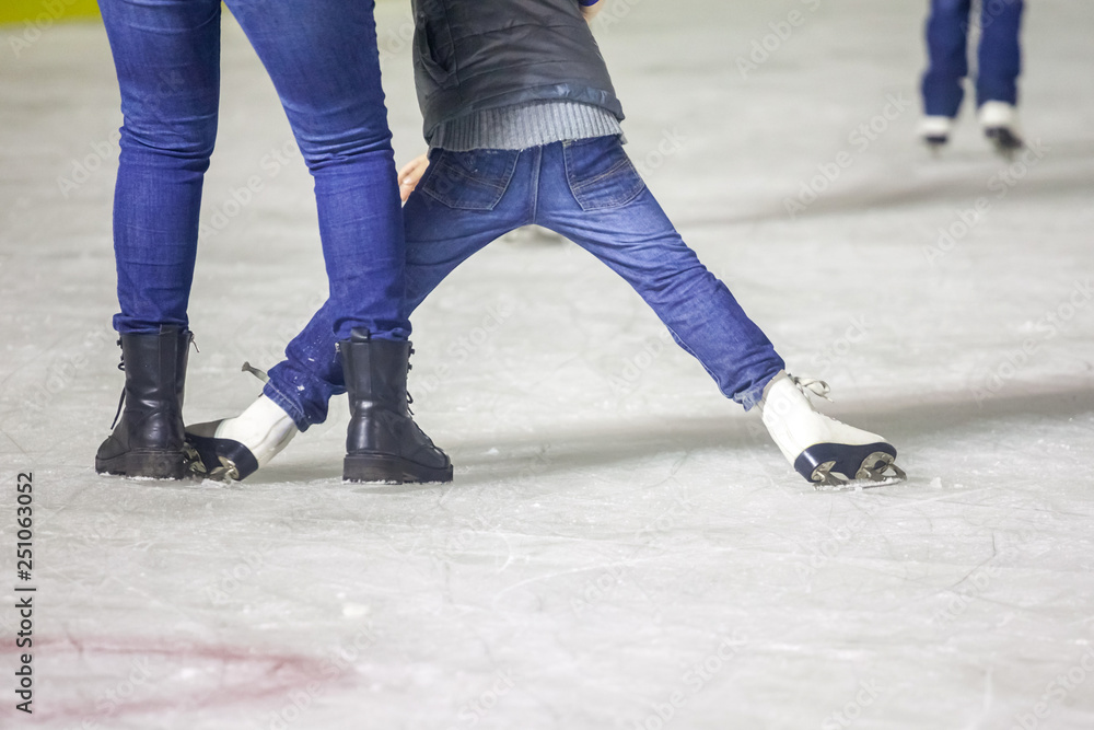 feet on the skates of a person rolling on the ice rink Stock Photo ...
