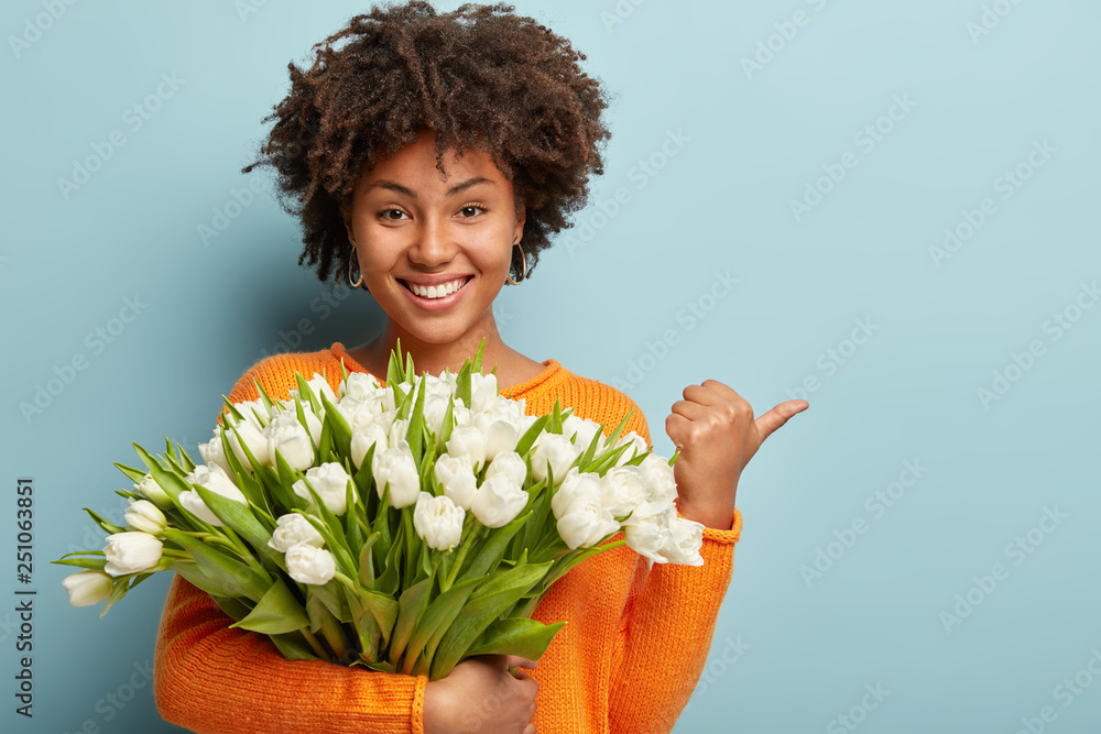 Beautiful pleasant looking cheerful woman with calm happy expression ...