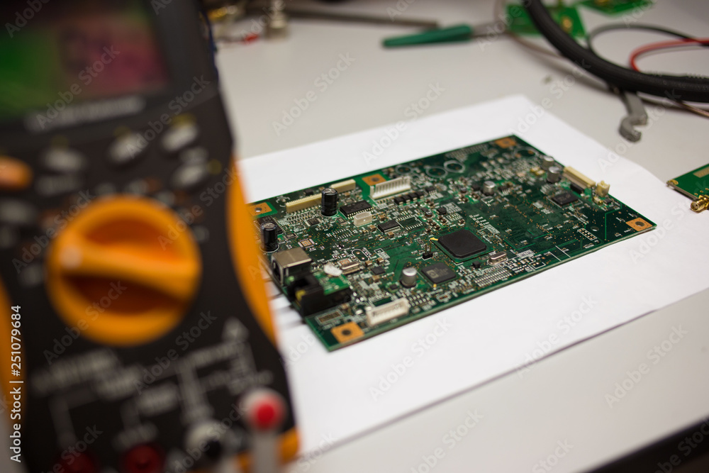 yellow modern multimeter with electrical board at the background Stock ...