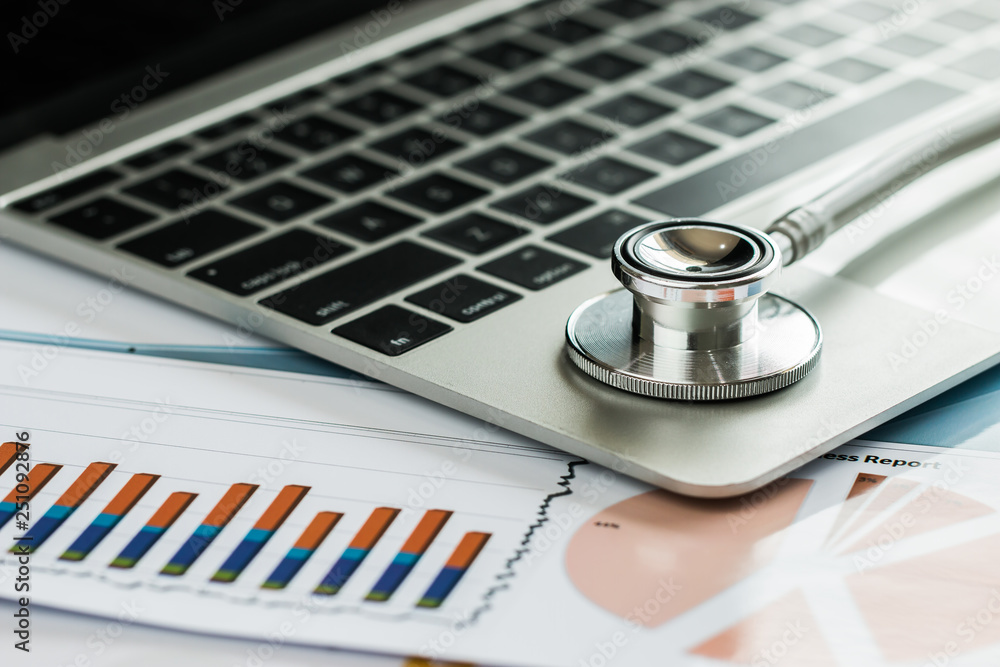 Stethoscope on computer with test results in Doctor consulting room ...