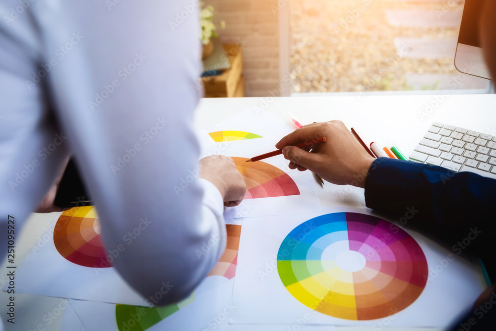 Designer graphic designer teamwork brainstorming about color swatch in ...