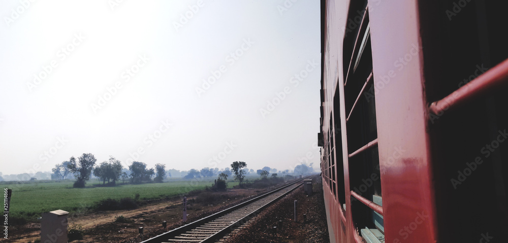 Looking out of the window of a express train of Indian railways with a ...