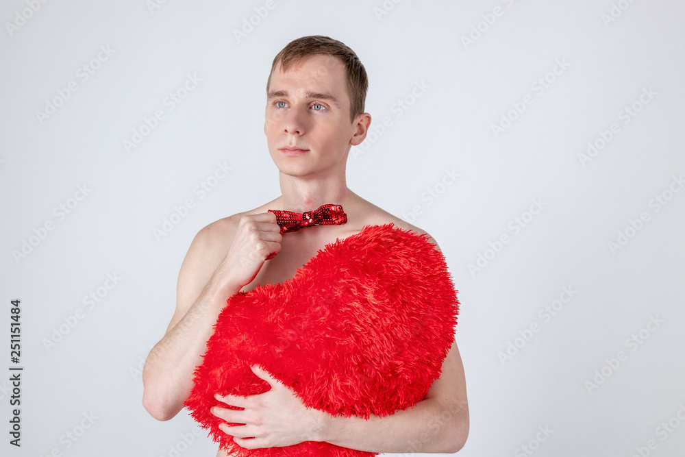 Handsome guy hold big red heart on white background. Love and romantic ...