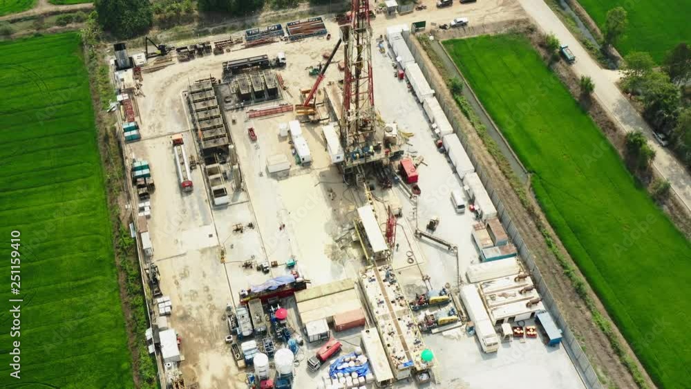 Oil and gas a land rig, onshore drilling rig, in the middle of a rice ...