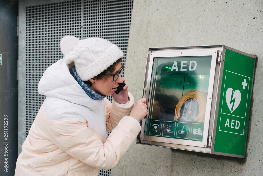 medicine cardiopulmonary resuscitation emergency call. Caucasian woman uses telephone calling ...