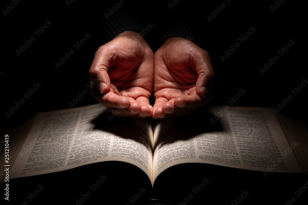Praying Hands With Bible Background