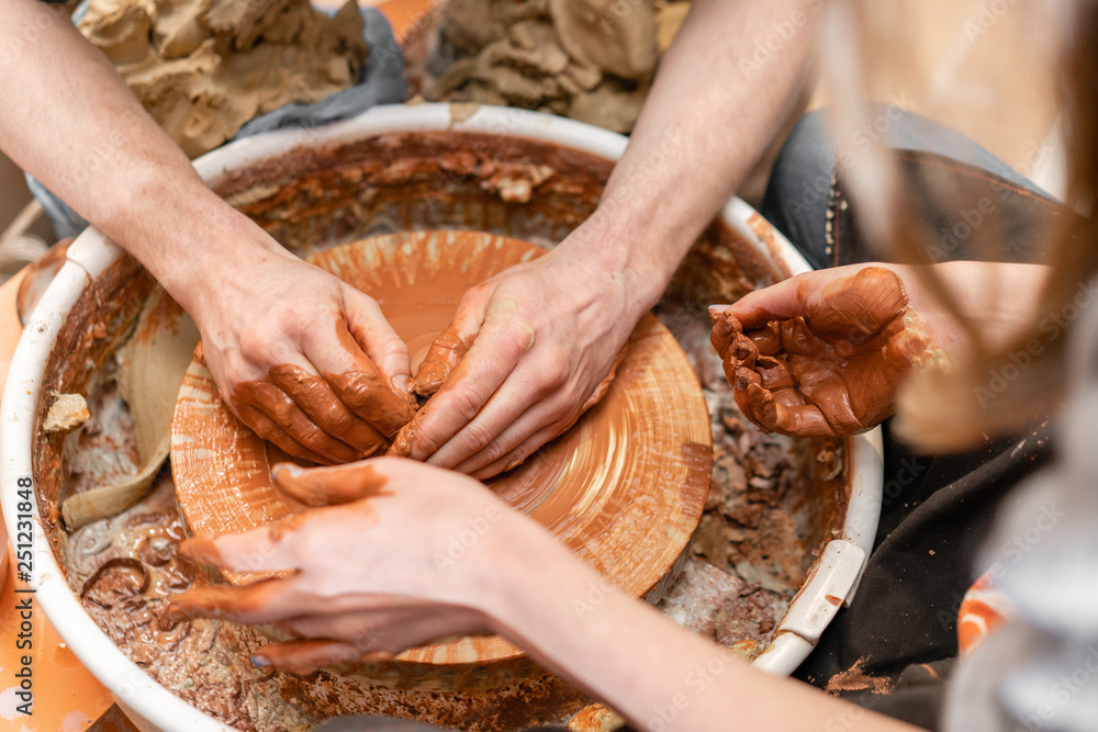 Master ceramist teaches student.Master ceramist teaches student ...