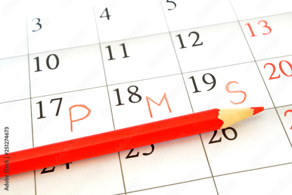 sheet monthly calendar with red letter of word PMS (premenstrual ...