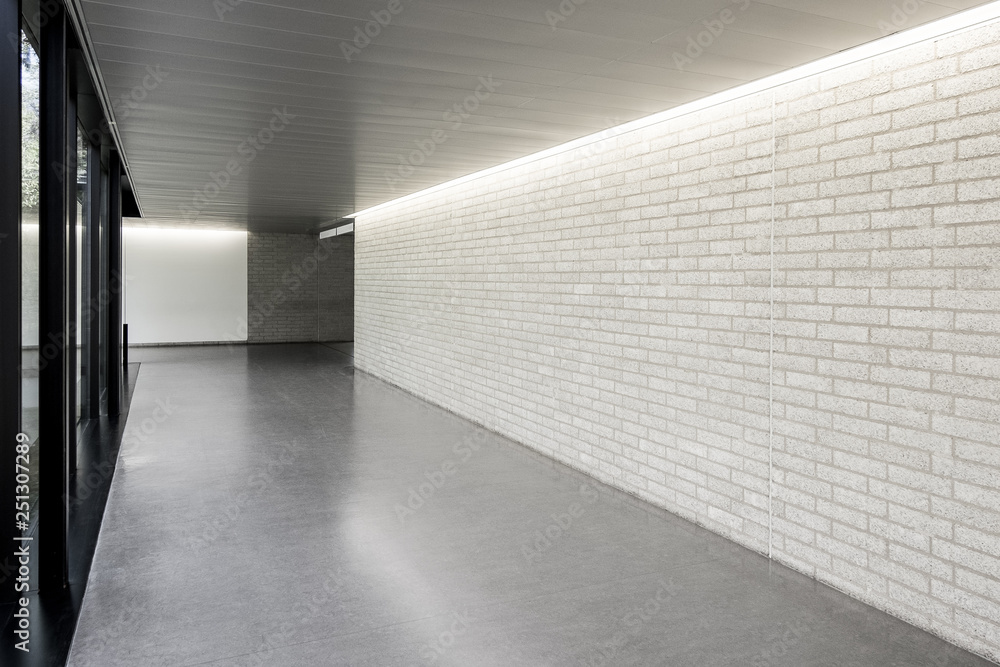Large glass hall with white brick wall for presentation, Exhibition ...