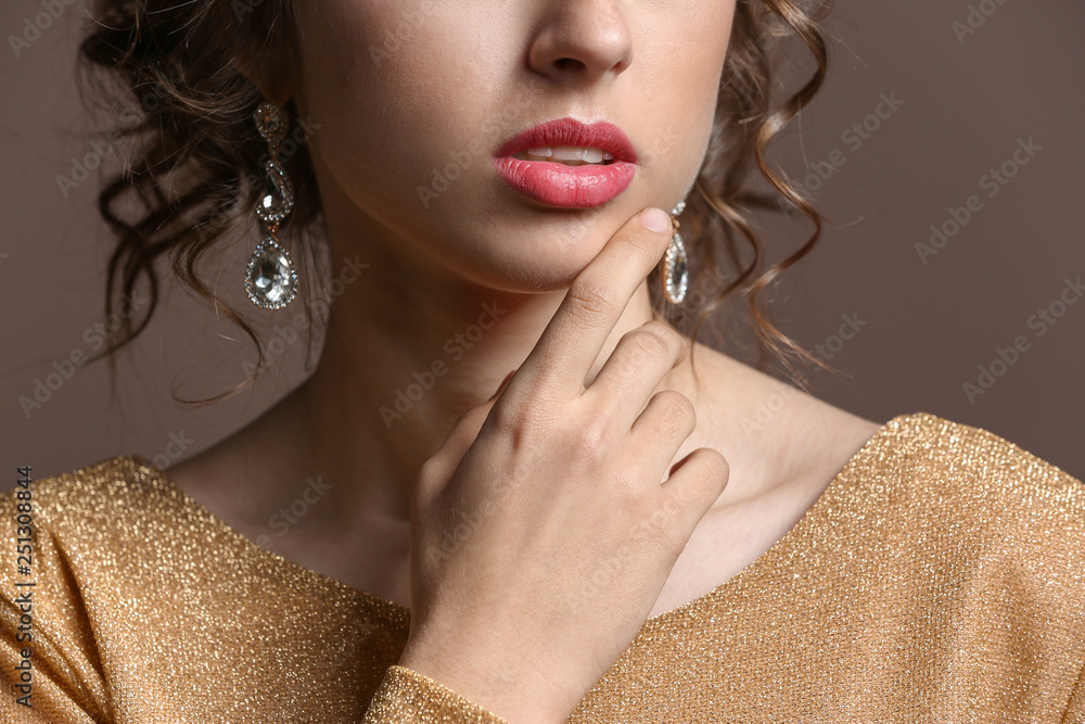 Young woman with beautiful jewelry on color background, closeup Stock ...