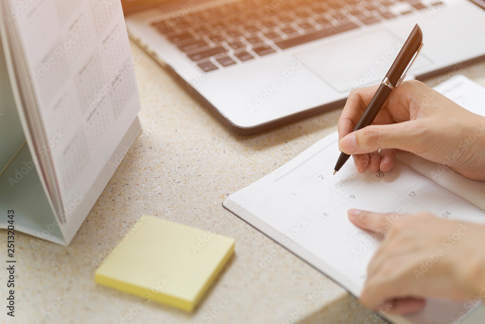 Businesswoman planning agenda and schedule using calendar event planner ...