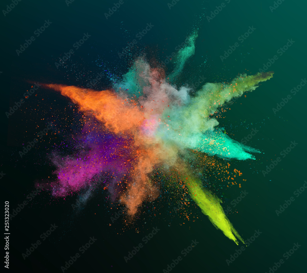 Colored powder explosion on dark gradient background. Freeze motion ...