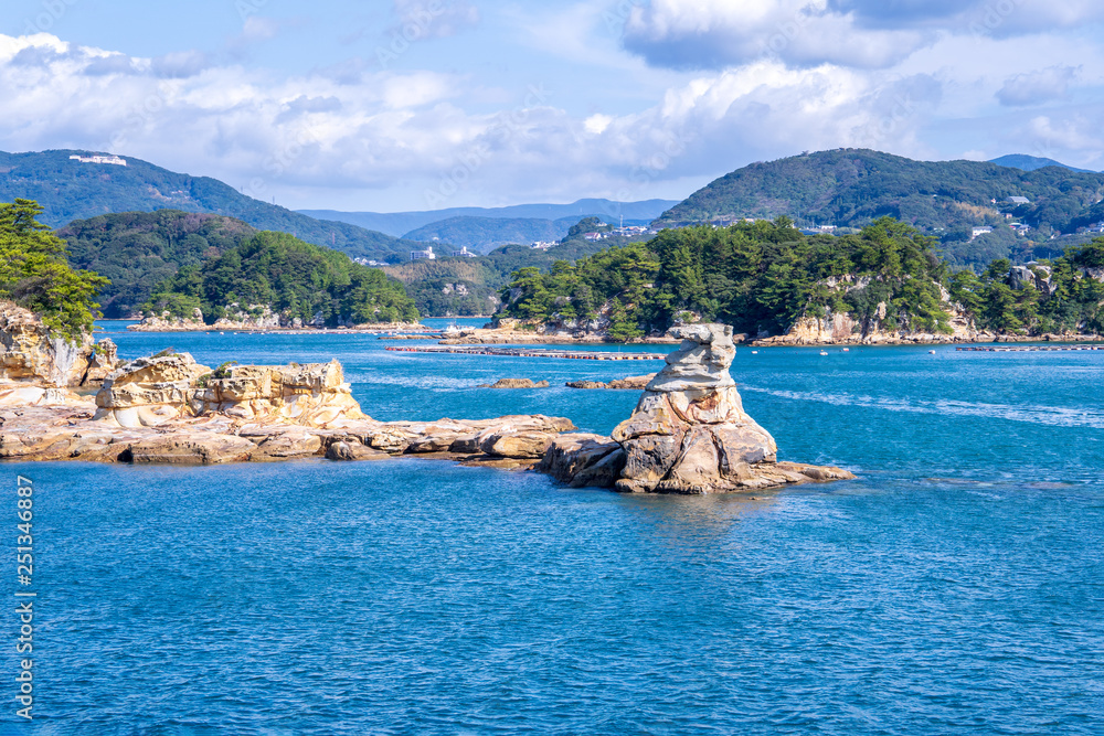Many small islands over the blue ocean in sunny day, famous Kujukushima ...