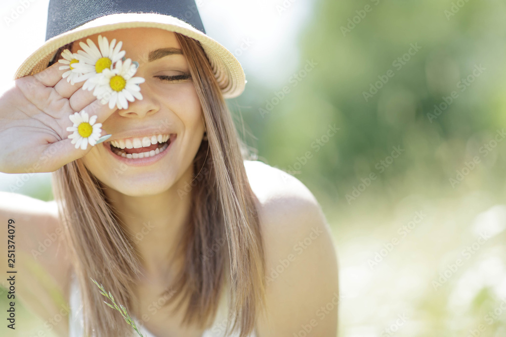 Woman with a flower Stock Photo | Adobe Stock