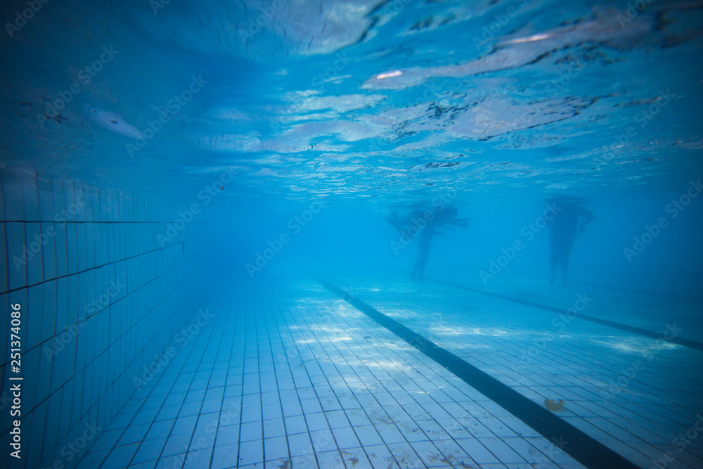 Wide angle underwater photo inside an olympic sized swimming pool with ...