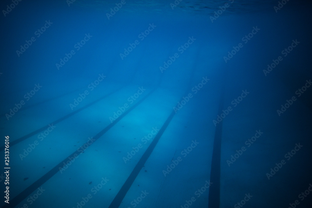 Wide angle underwater photo inside an olympic sized swimming pool with ...
