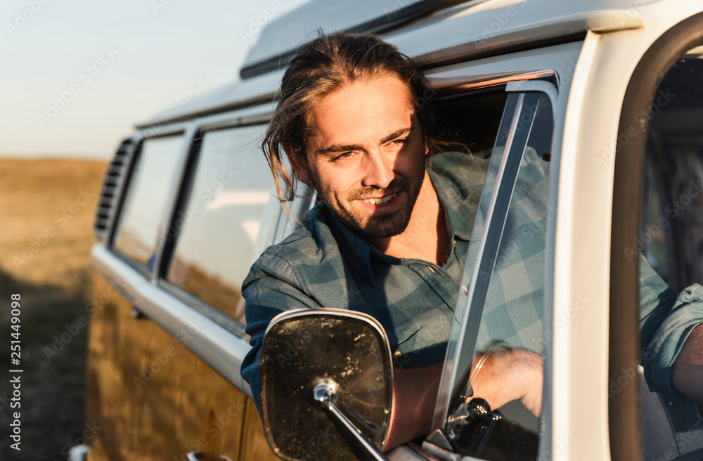Young man on a road trip with his camper Stock Photo | Adobe Stock