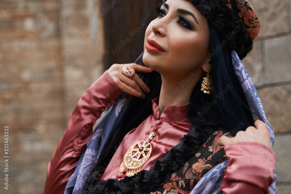 Beautiful middle eastern woman wearing traditional dress, posing ...