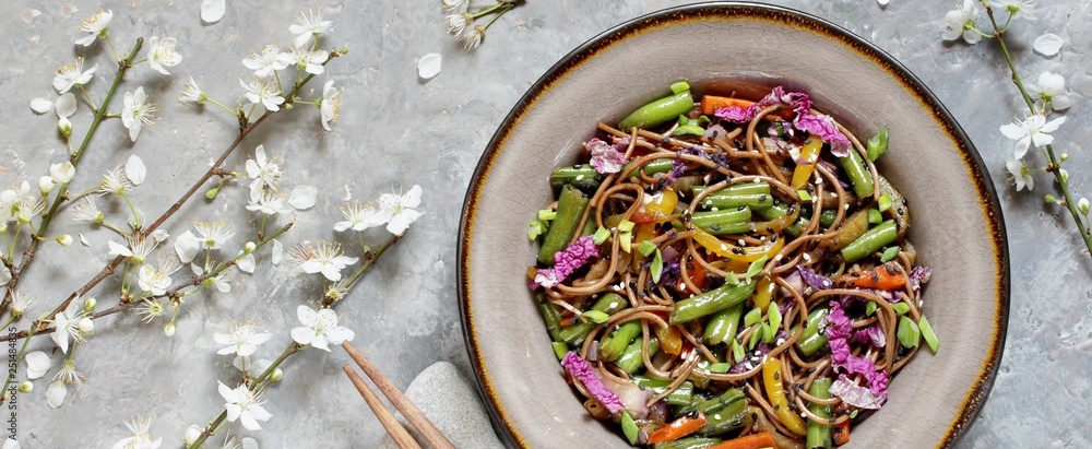 Asian noodles buckwheat soba fried with vegetables. in a gray plate in ...