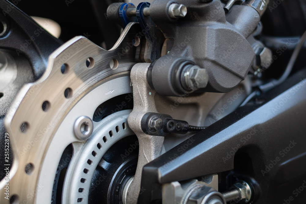 Closeup detail of sport racing motorcycle wheel and ABS brakes system ...