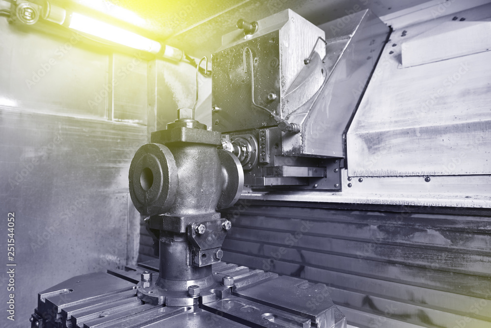 The body for creating the valve is installed on the table of the CNC ...