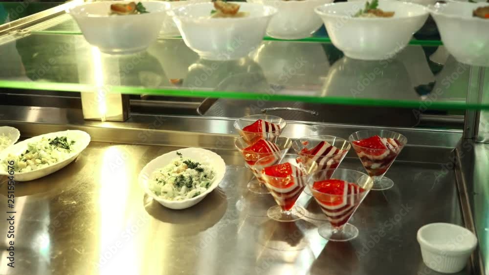 close-up, showcase with salads and jelly desserts in canteen, mess hall ...