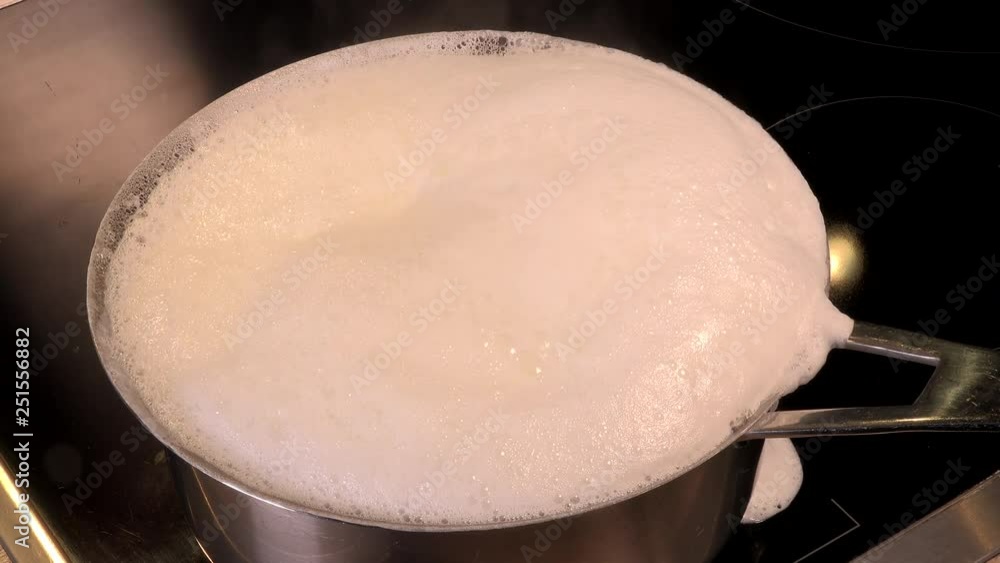 Cook natural organic milk, boil the milk in pots, milk that is about to ...