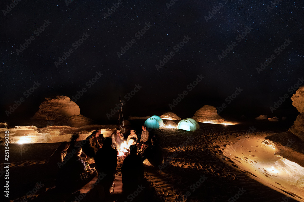 Tourists camping in the desert under the stars in the White desert ...