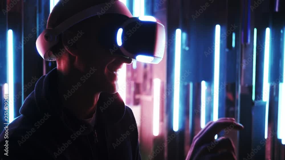 Side view man using VR headset moving hands side to side ,scrolling ...