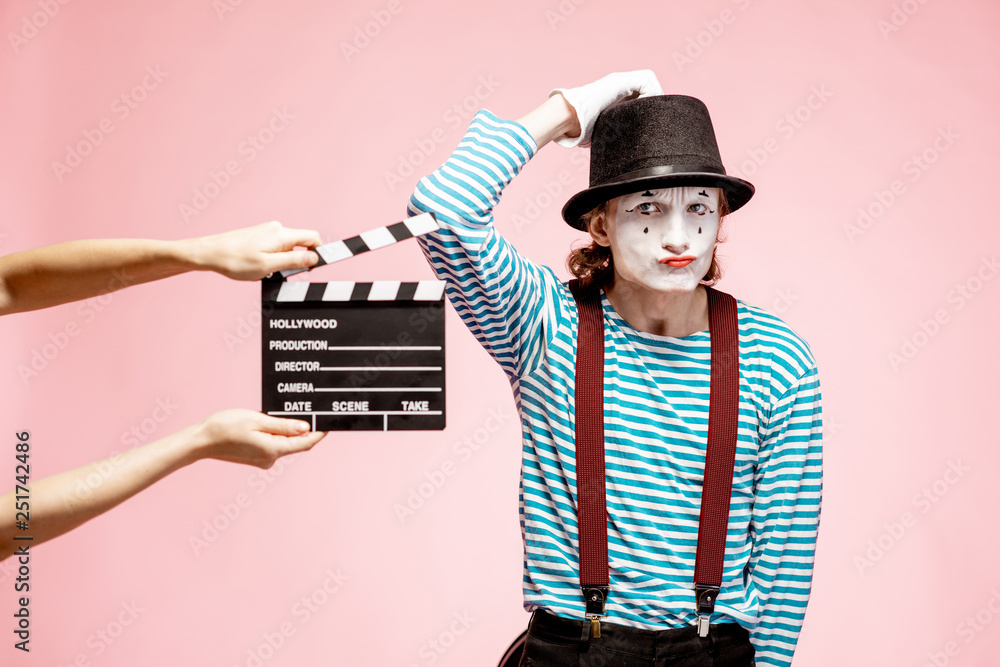 Portrait of an actor as a pantomime with cinematography clapperboard on ...