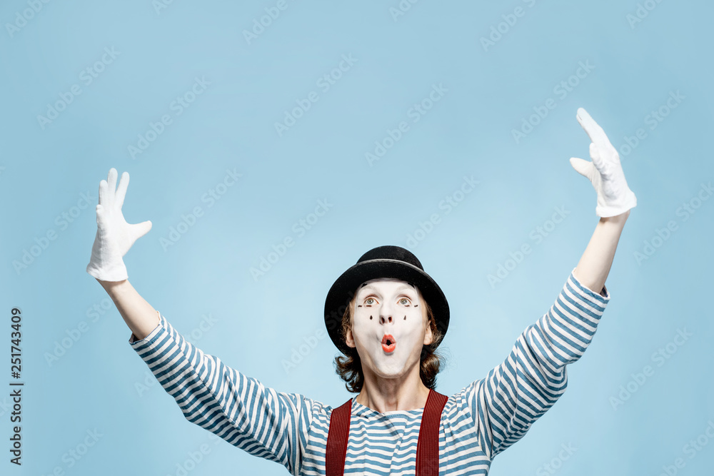 Emotional pantomime with white facial makeup showing empty space on the ...