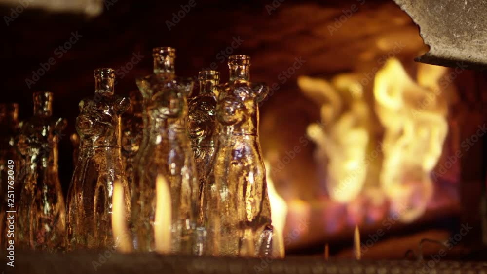 Glassworks manufacturing process . Production of glass bottles . Bottle ...