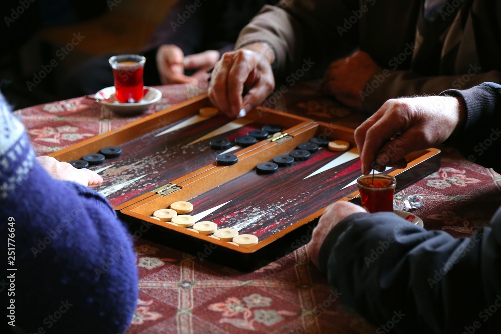 people playing backgammon Stock Photo | Adobe Stock