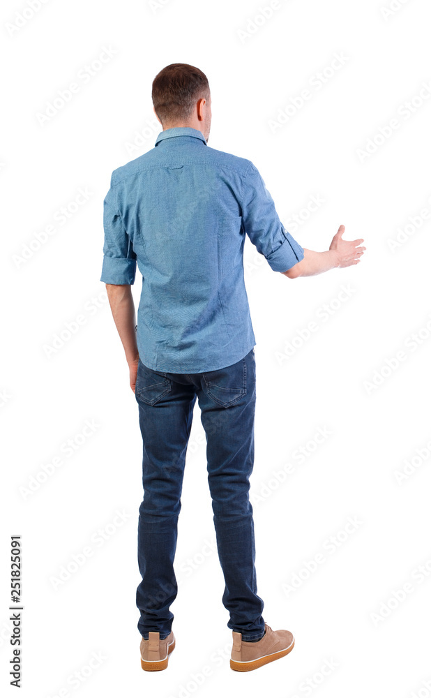 Back view of a man who stretches his hand for a handshake. Stock Photo ...