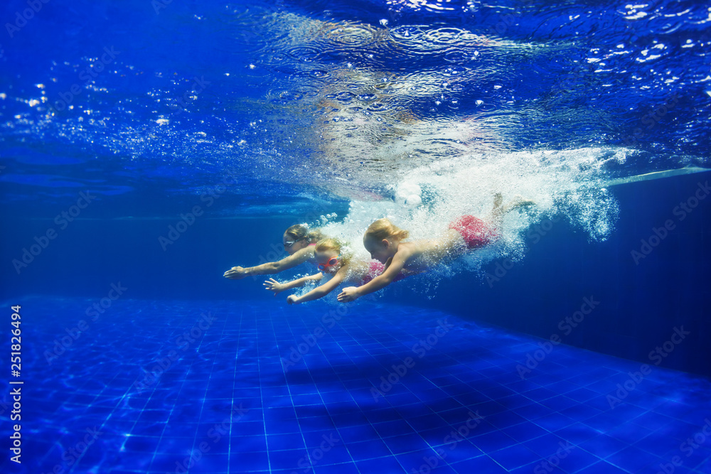Happy family - mother, kids learn to swim, dive underwater with ...