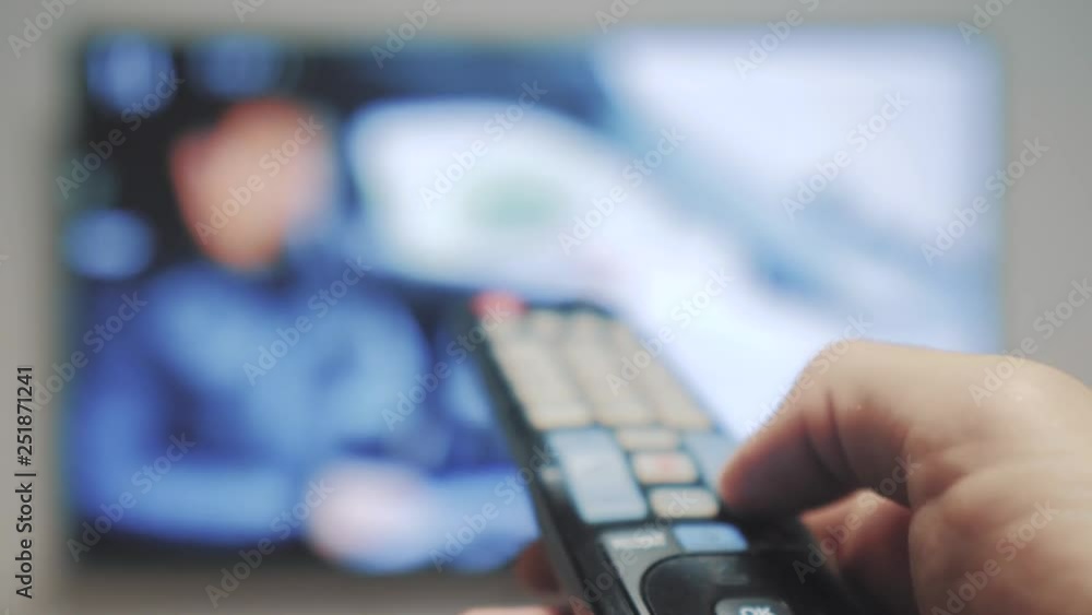 man hand holding the TV remote lifestyle control and turn off smart tv ...