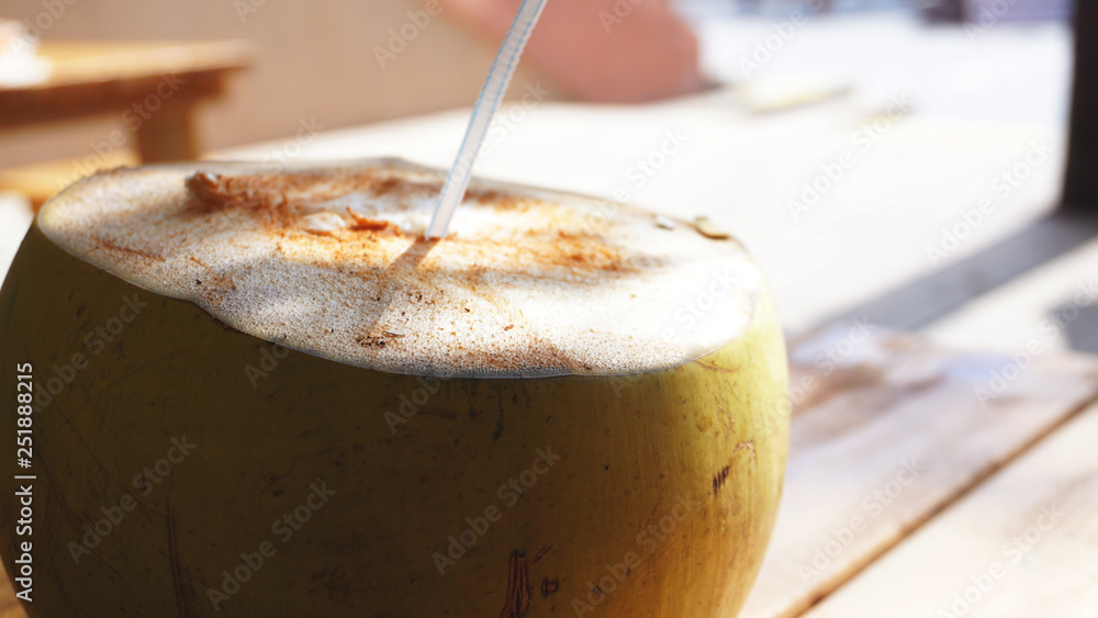 Coconut Water Drink on table with blurry background. Beach cafe, travel ...