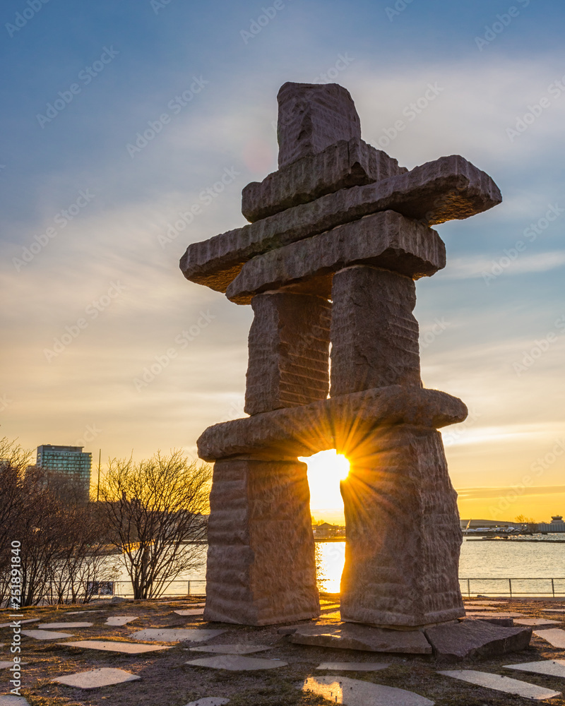 Sun rising in Toronto Canada, seen through an Inuit stone structure ...