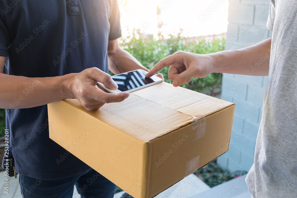 delivery service concept, customer hand receiving a cardboard boxes ...