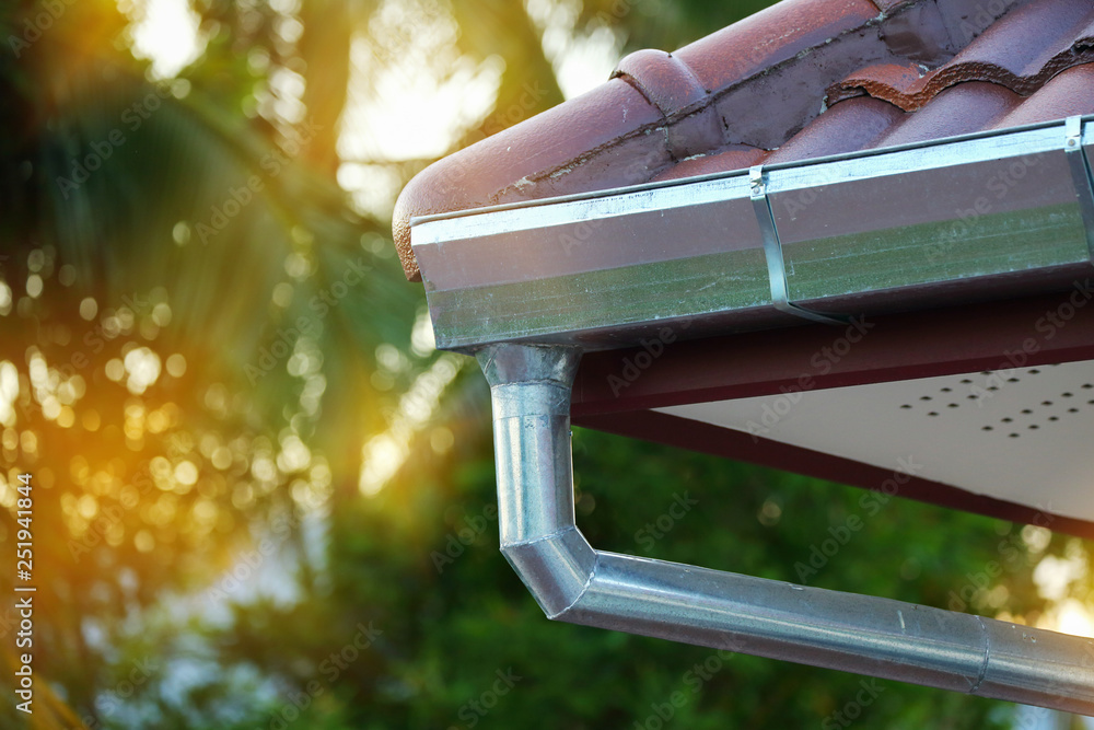 pipe stainless steel of roof gutter on residential house Stock Photo ...
