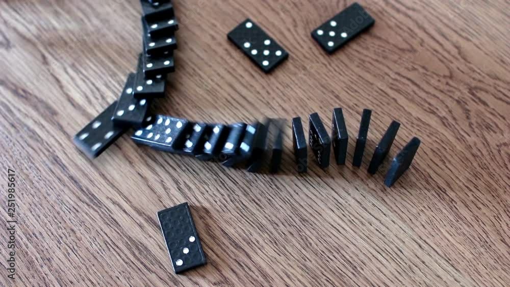 black domino cards with white dots in rows and balanced one after the ...