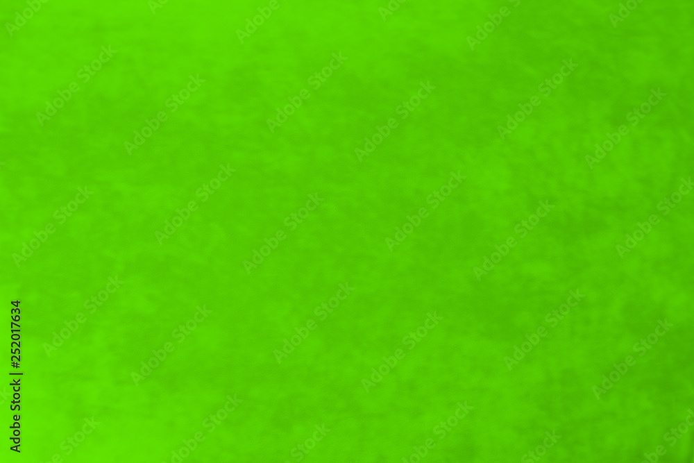 It is a background of fabric of green color of non-uniform texture ...