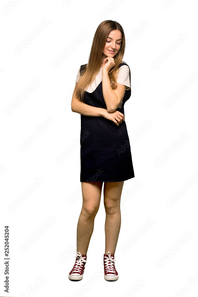 Full body Young pretty woman looking down with the hand on the chin on ...