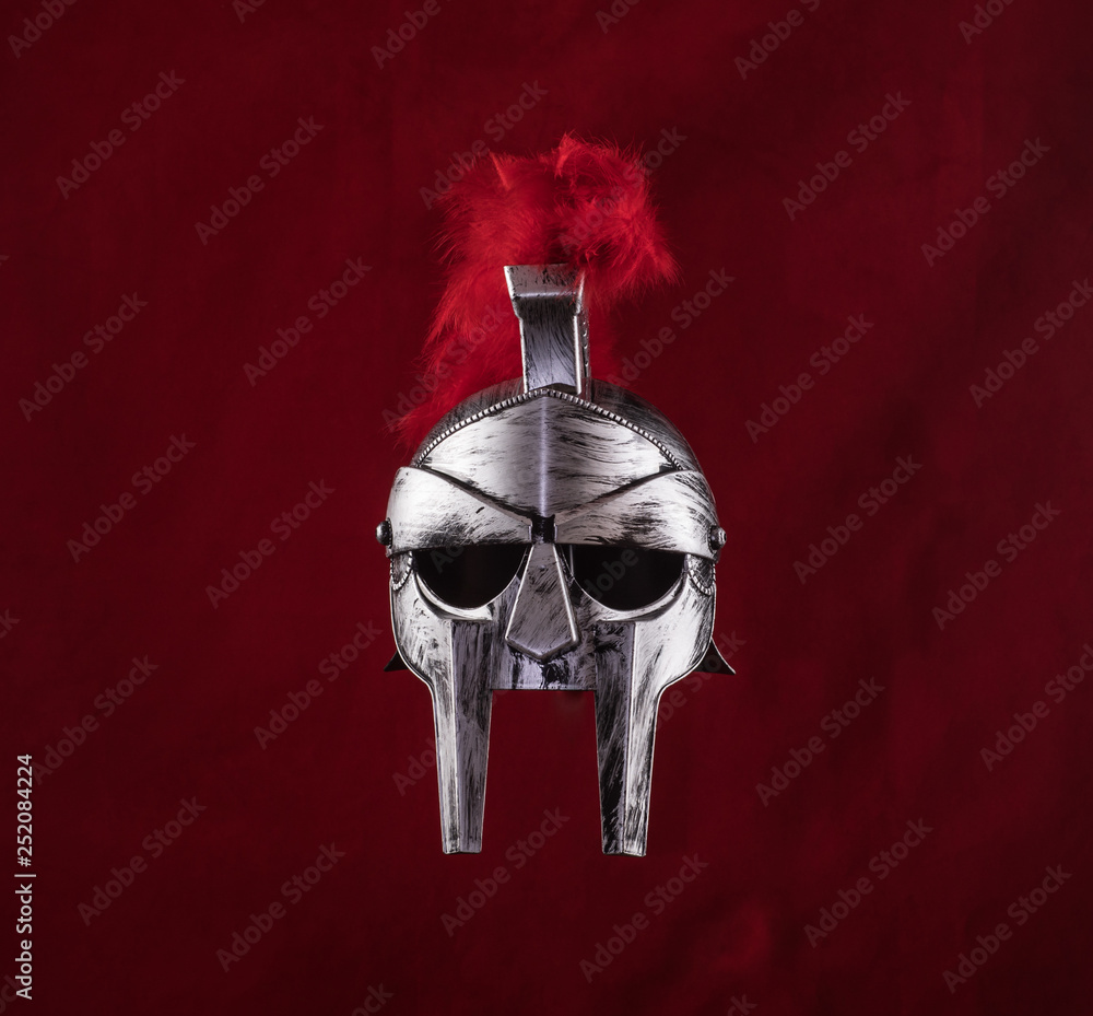 spartan helmet on a red background Stock Photo | Adobe Stock